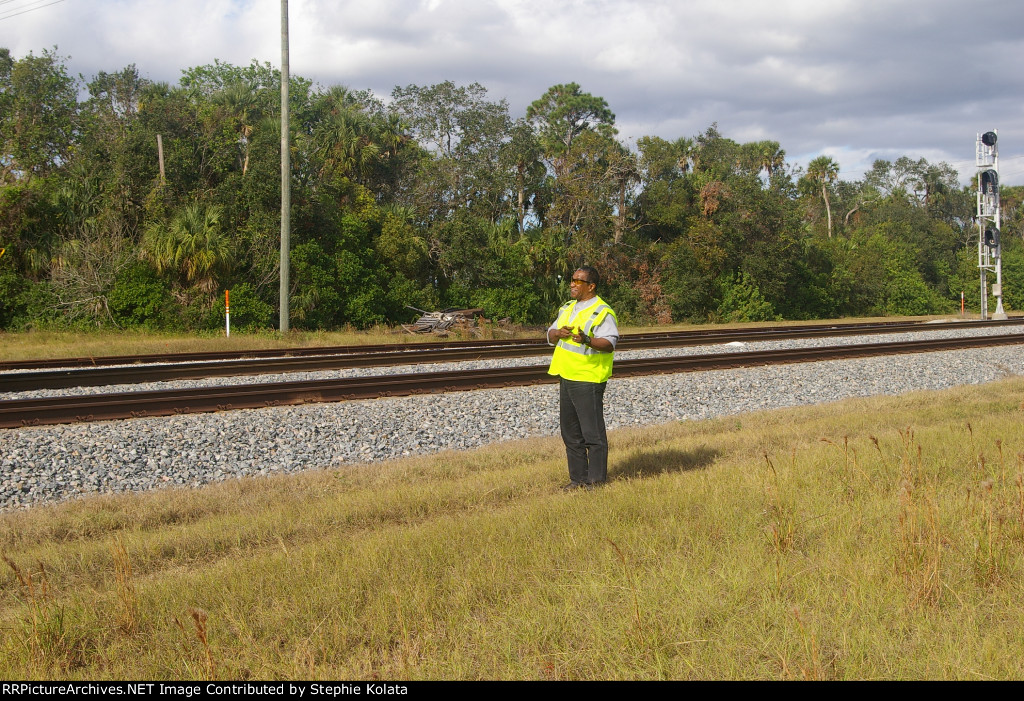 CONDUCTOR RODNEY WAITING FOR SANTA TRAIN TO PASS BY